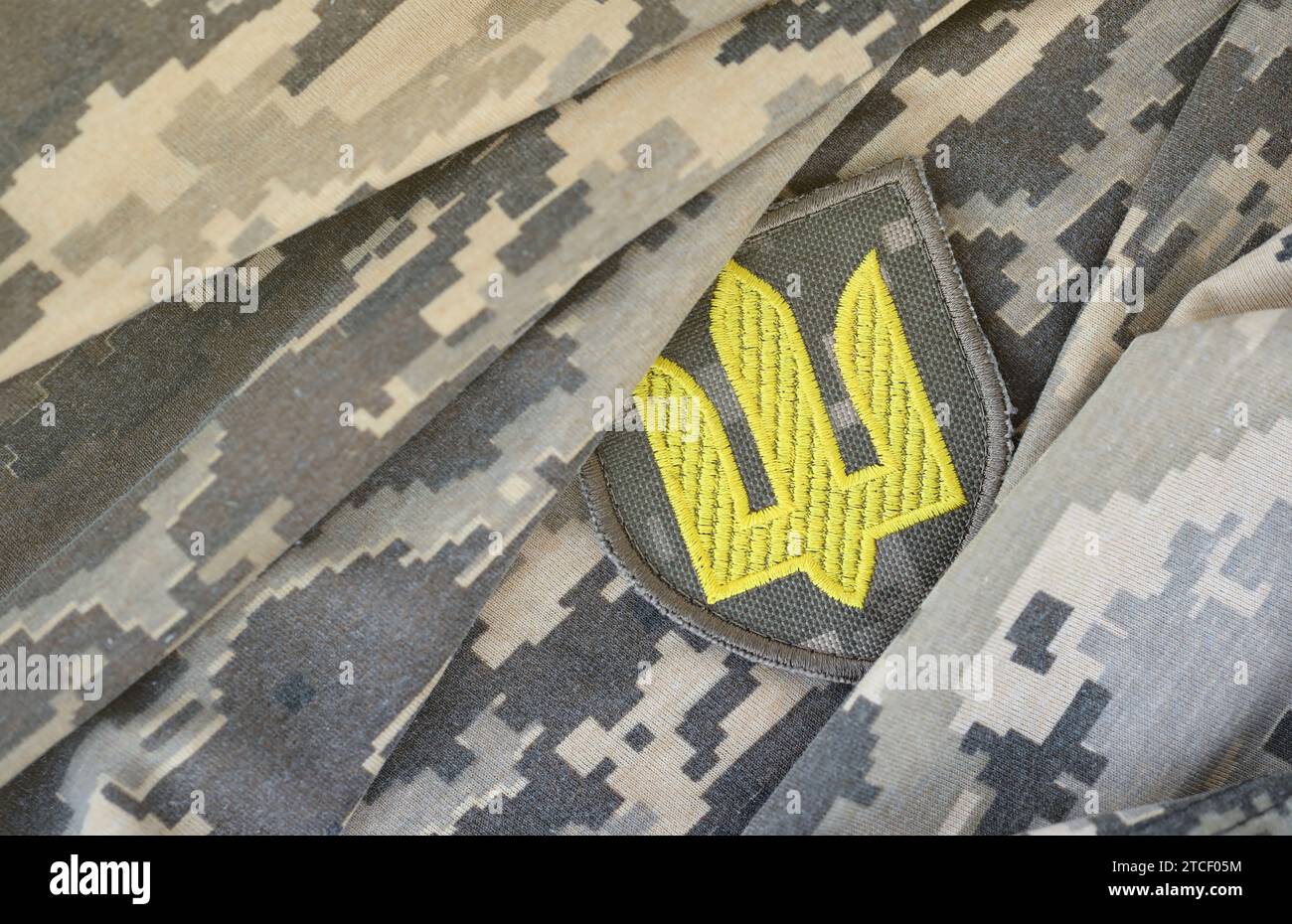 Symbol of Ukrainian army on the camouflage uniform of a Ukrainian ...