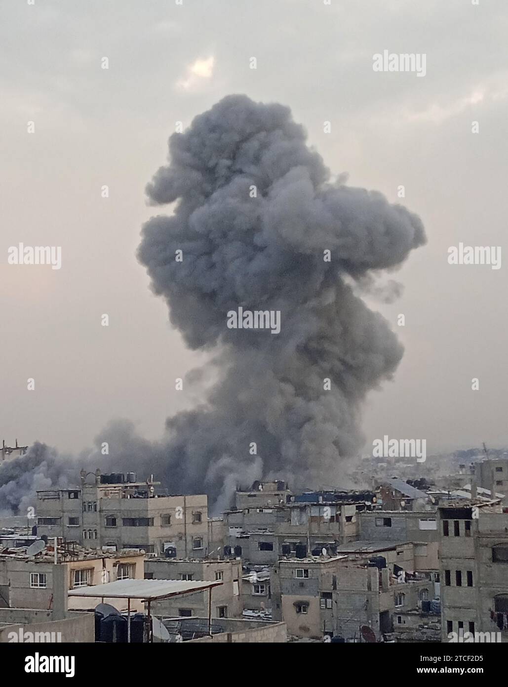 Rafah, Gaza. 12th Dec, 2023. A smoke plume erupts during Israeli ...
