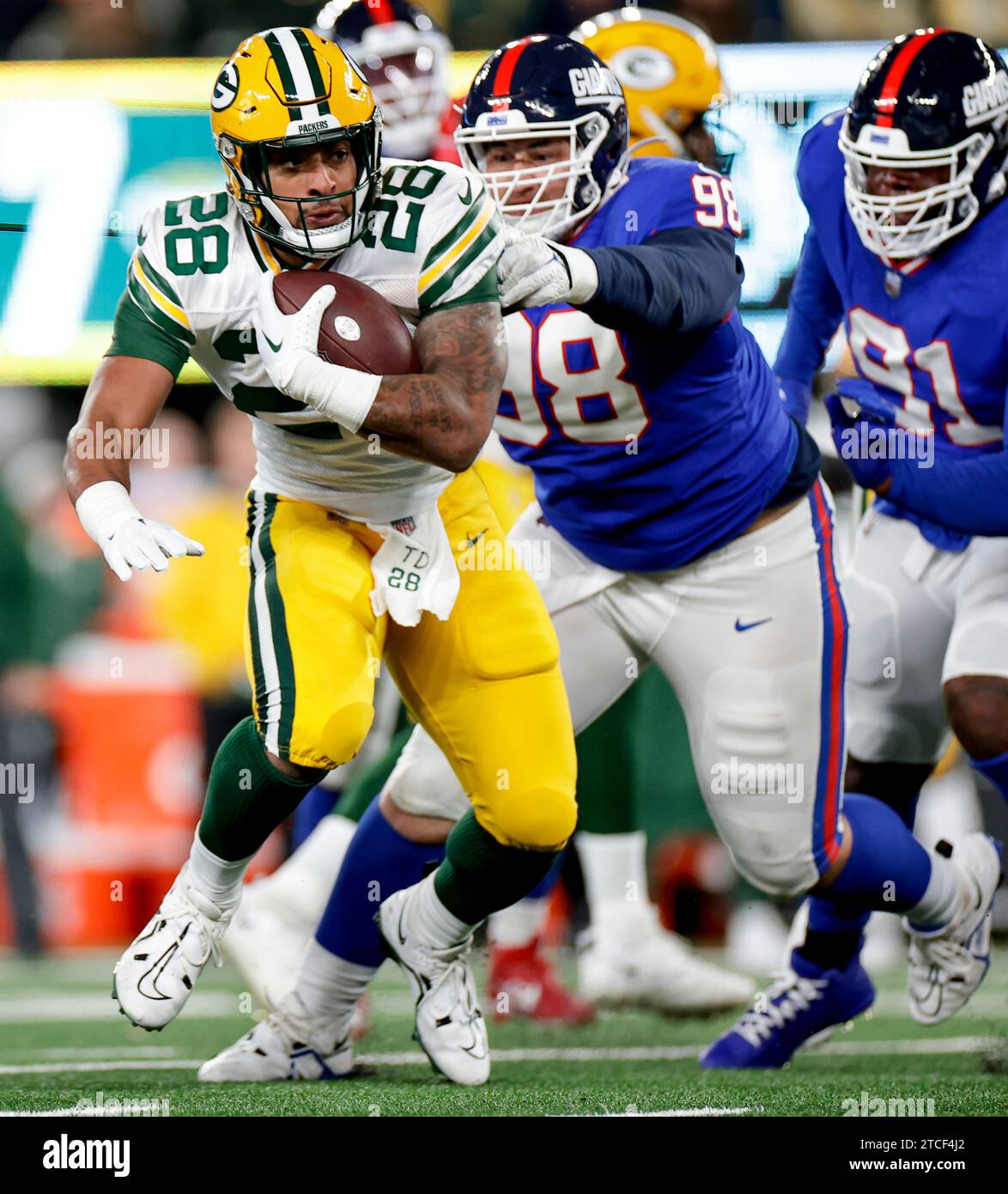 Green Bay Packers running back AJ Dillon (28) carries the ball against ...