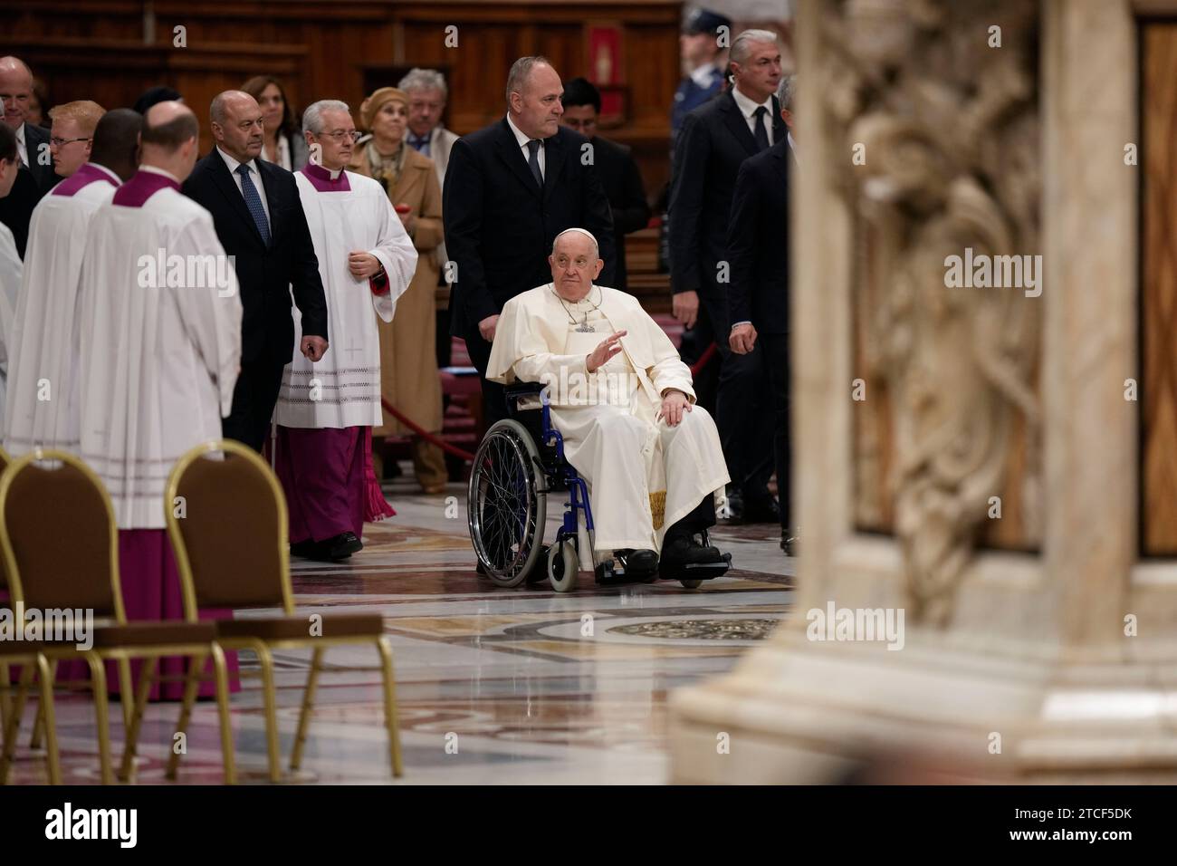 Pope Francis arrives in St. Peter's Basilica to attend a mass for the ...