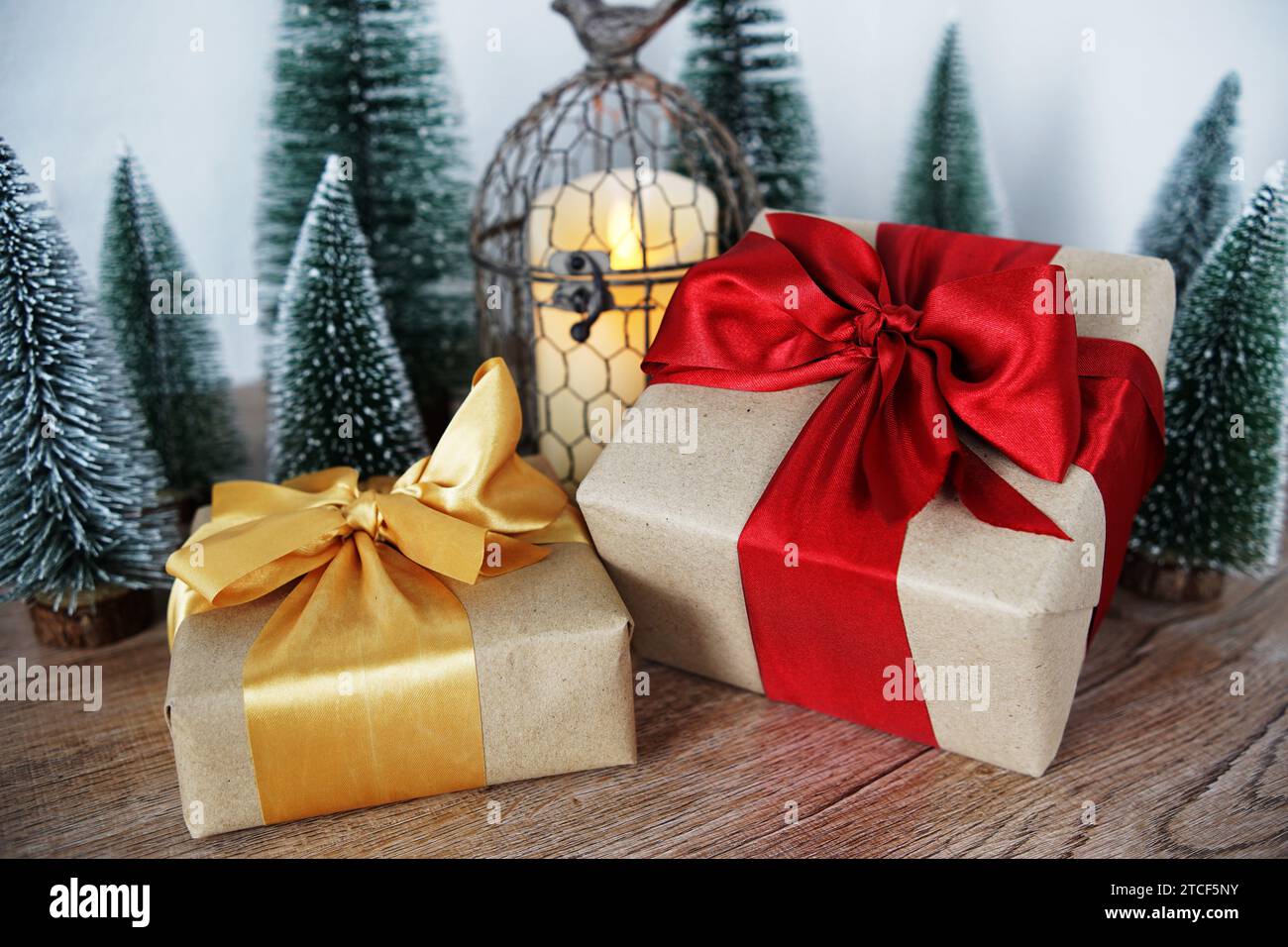 Gift boxes with Christmas tree and LED candle light Stock Photo - Alamy