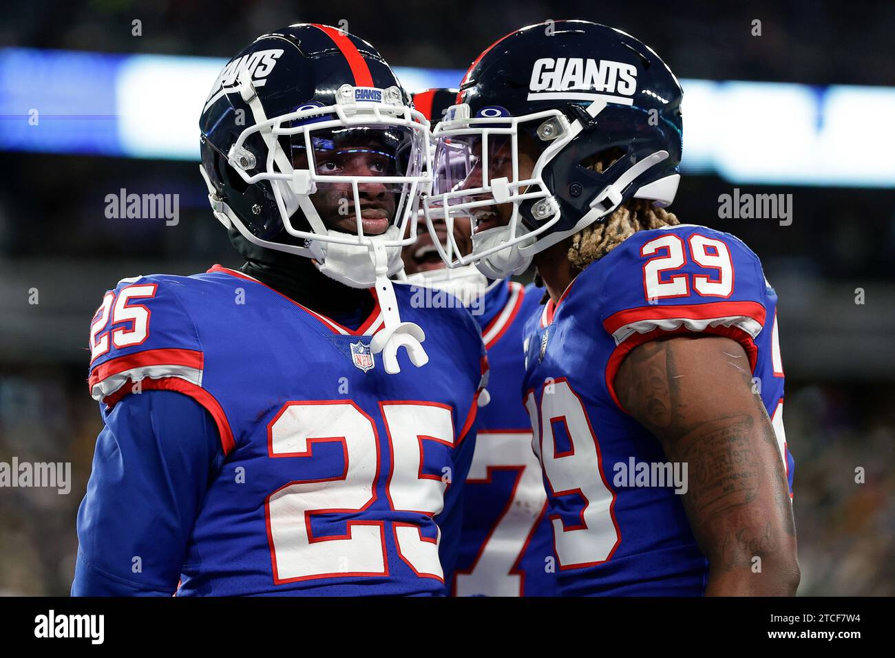 New York Giants cornerback Deonte Banks (25) talks with safety Xavier McKinney (29) during the ...