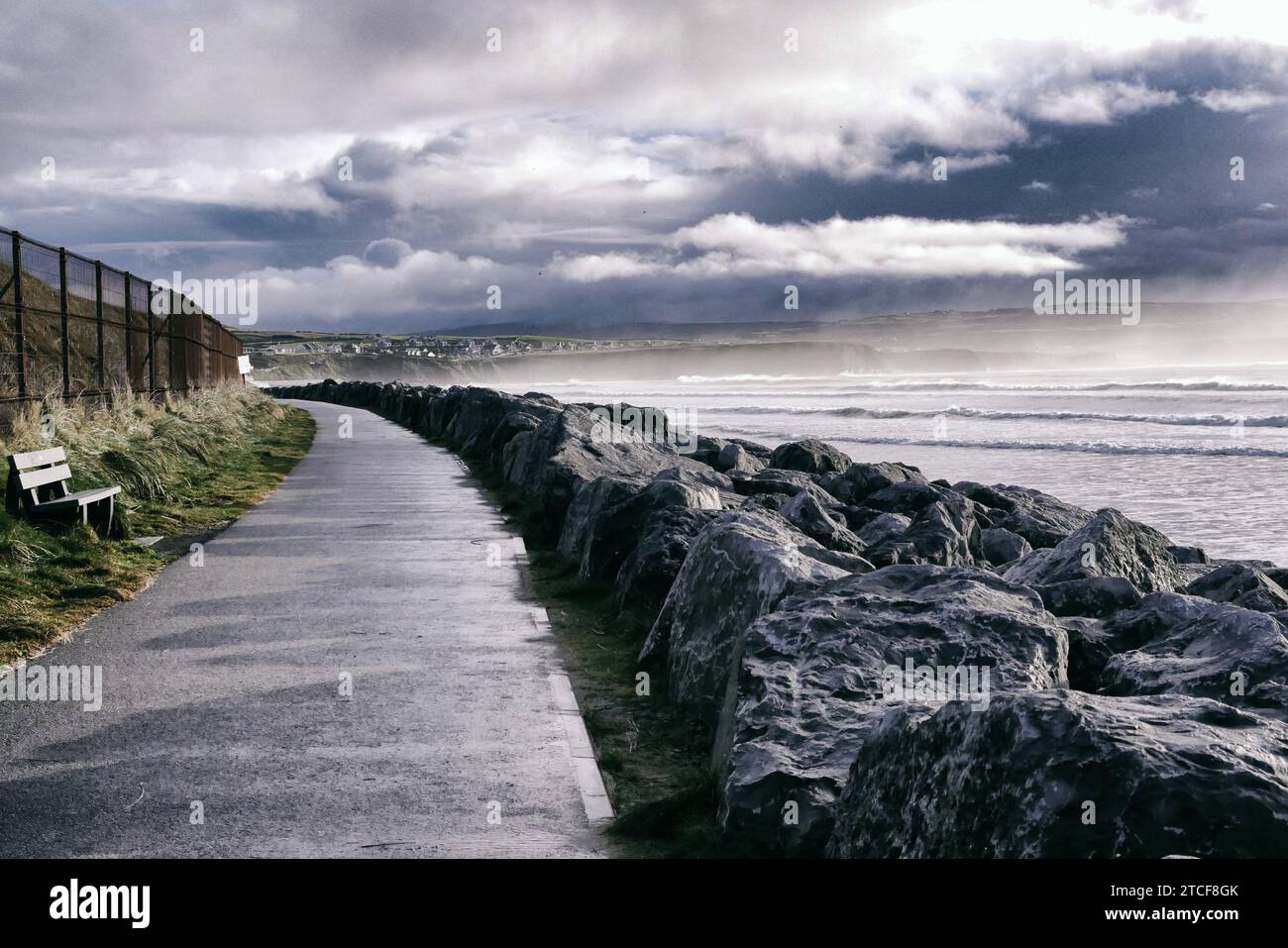 A seaside path with a view of the changing weather, Lahinch, Co Clare ...