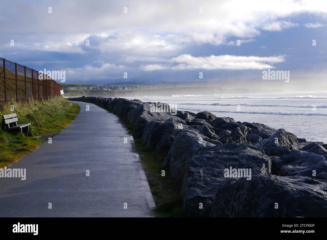 A seaside path with a view of the changing weather, Lahinch, Co Clare ...