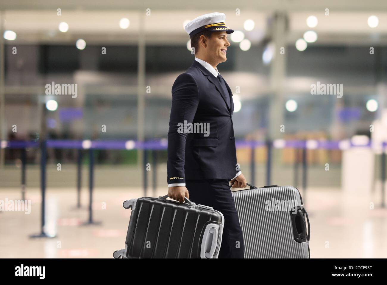 Profile of pilot walking in airport hi-res stock photography and images ...