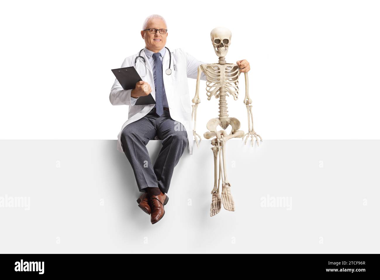 Doctor sitting on a blank panel and hugging a human skeleton isolated ...