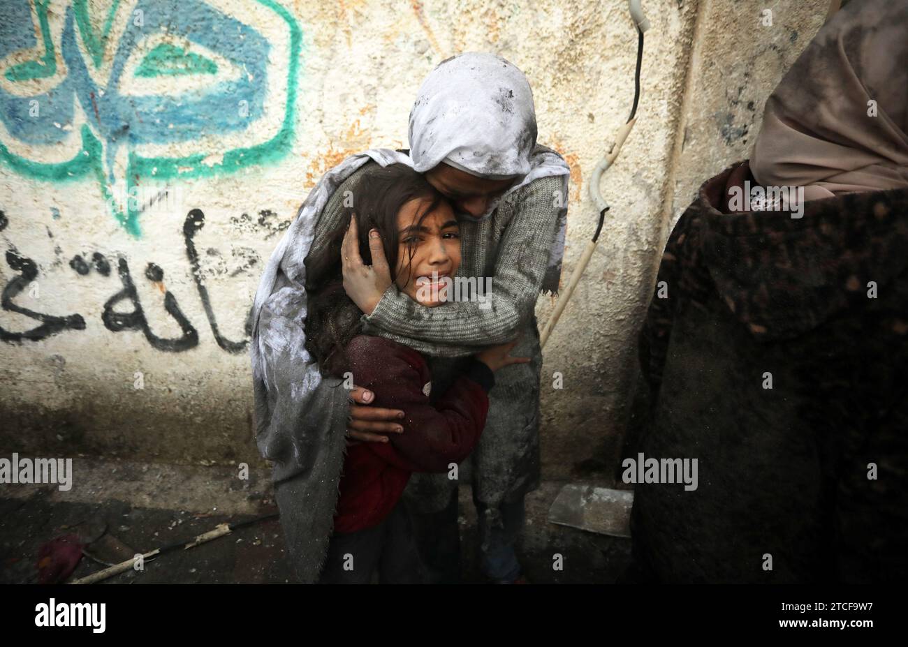 Rafah, Gaza. 12th Dec, 2023. Young Palestinians react following Israeli ...