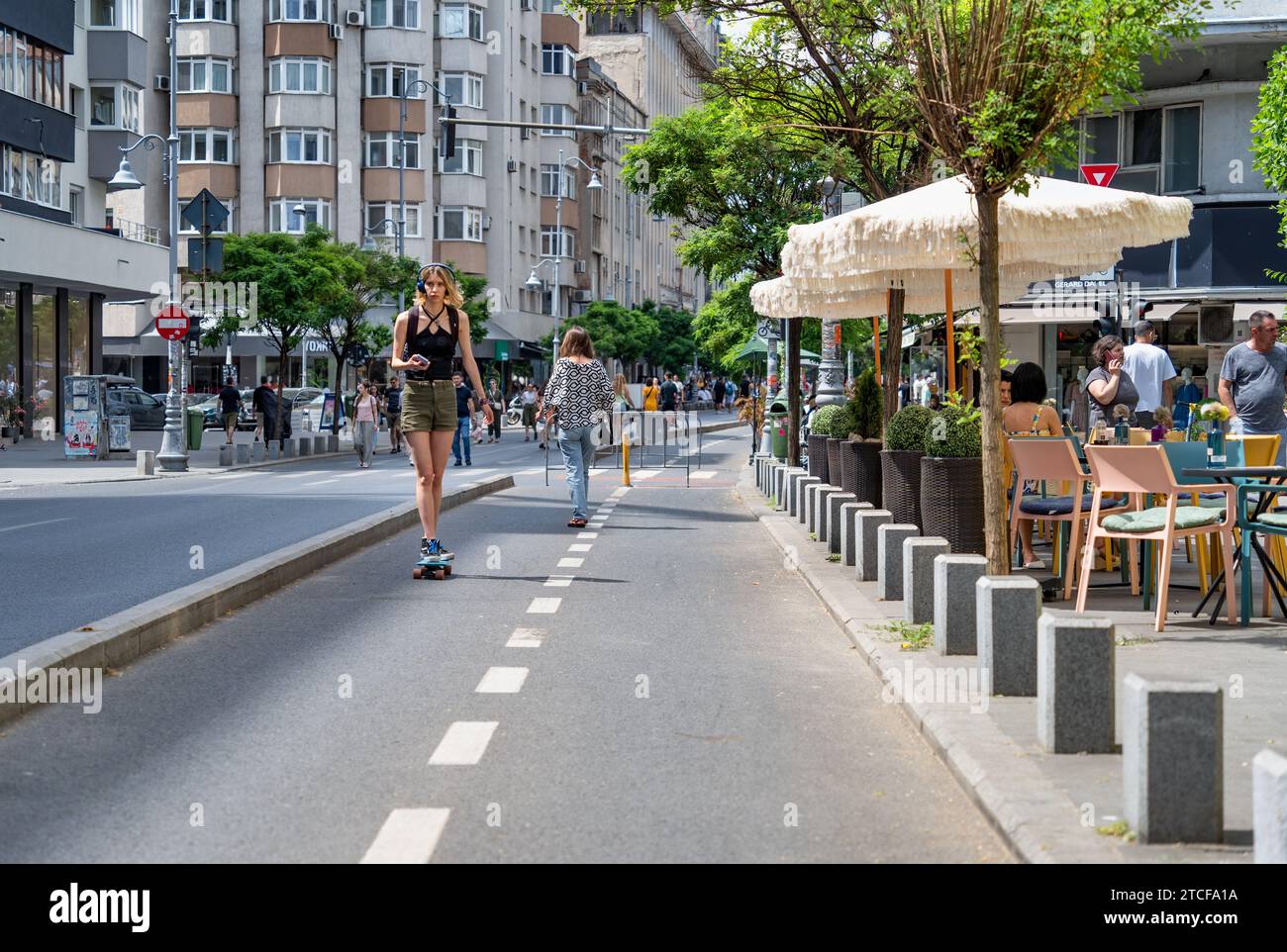Bucharest, Romania - June 17 2023: A girl riding a skateboard on the ...