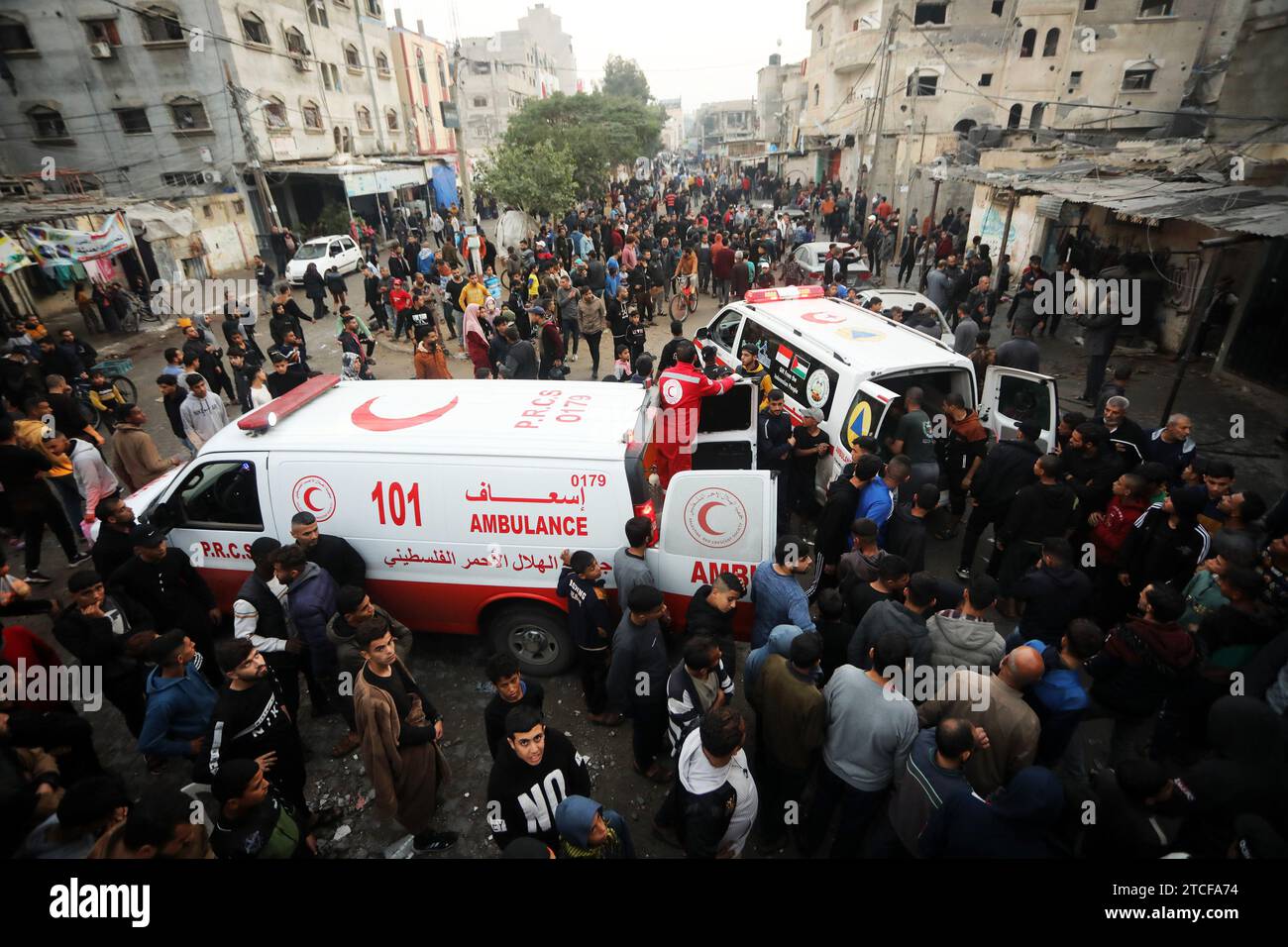 Rafah, Gaza. 12th Dec, 2023. Palestinians react near ambulances ...