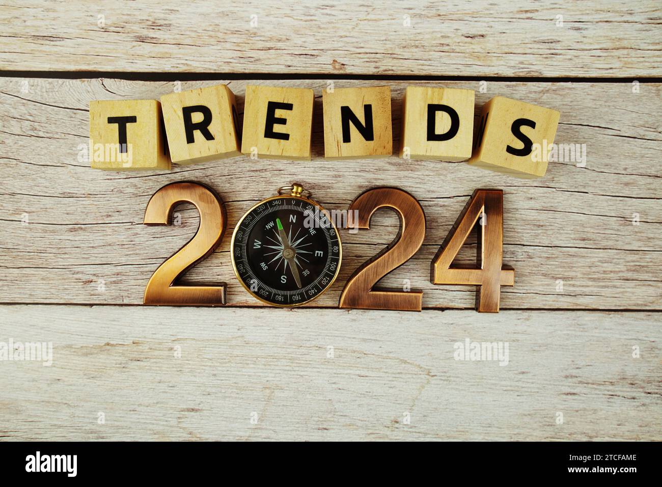 Trends of 2024 alphabet letters with magnifying glass on wooden ...