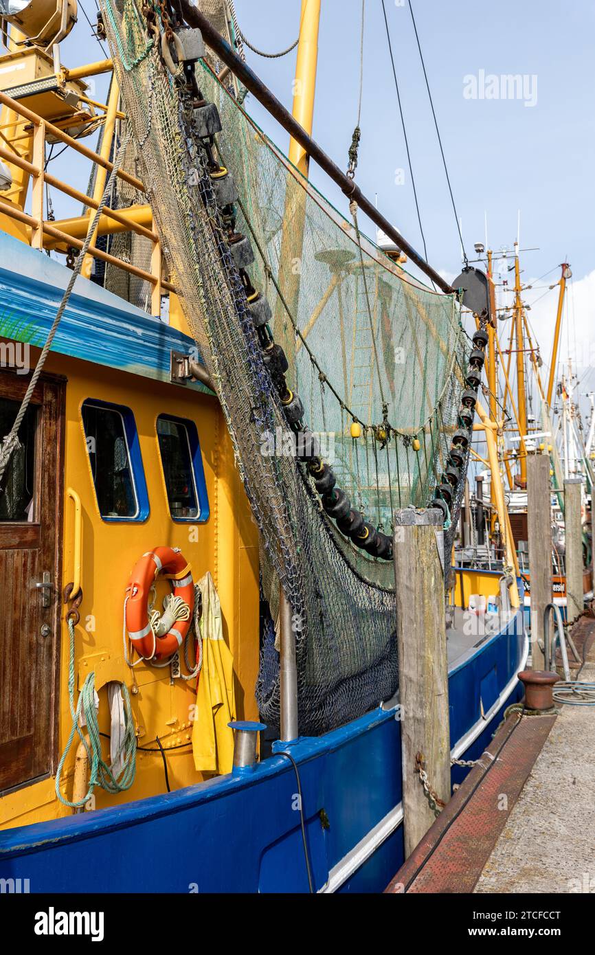 Colorful traditional old german fishing cutter boats moored ...