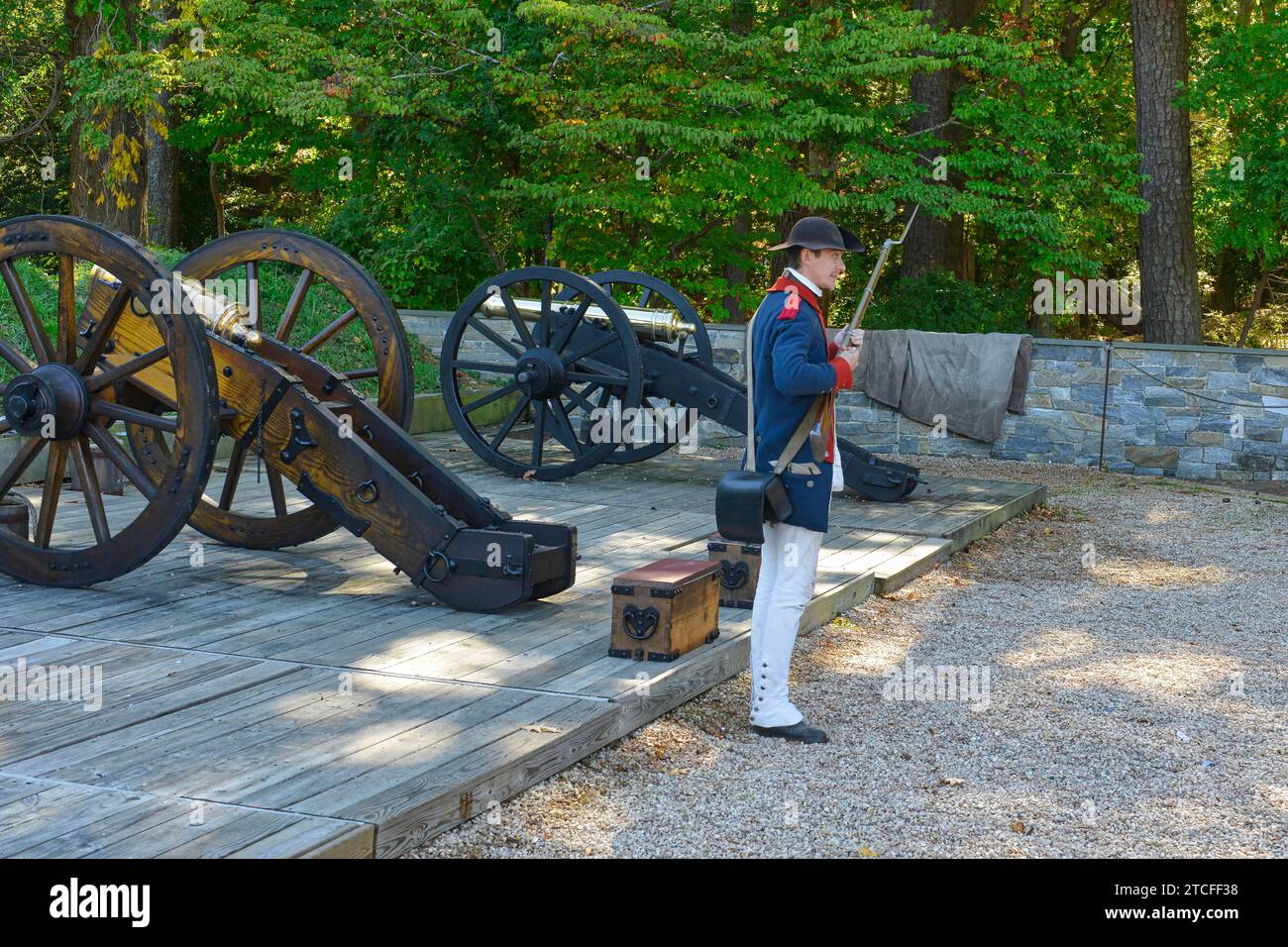 A soldier of the Revolutionery Army showing tourists the weapons of the ...