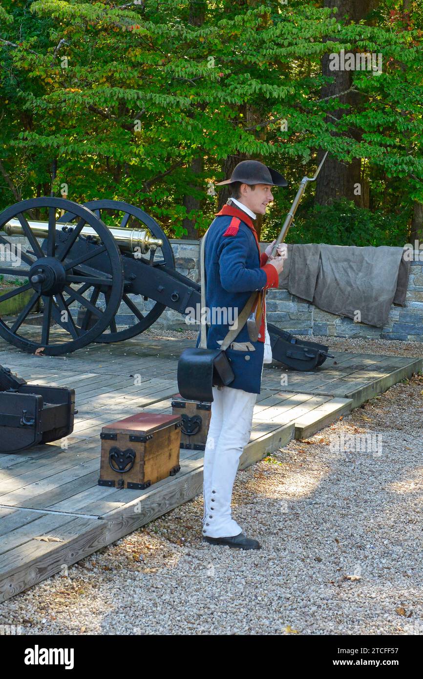 A soldier of the Revolutionery Army showing tourists the weapons of the ...