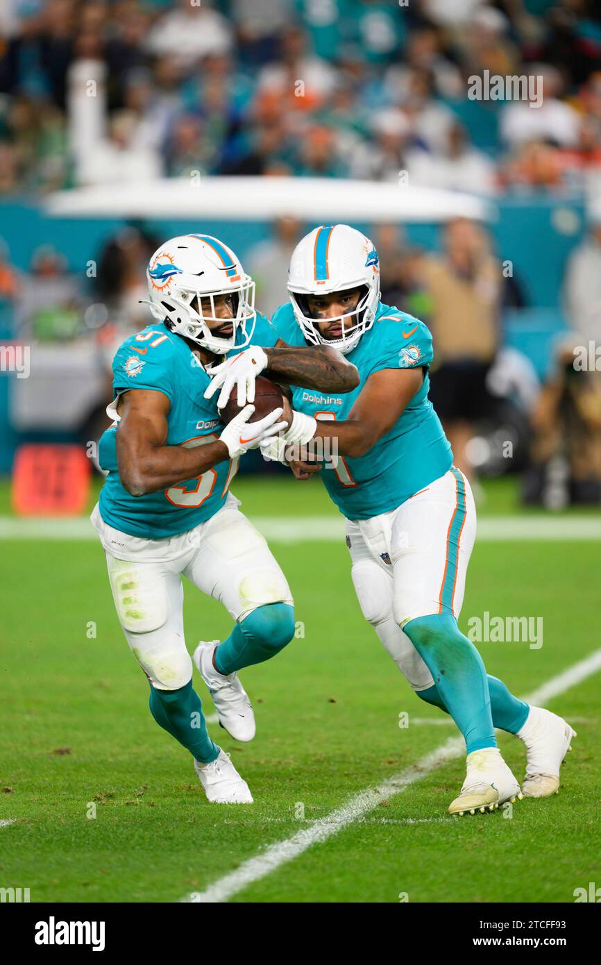 Miami Dolphins quarterback Tua Tagovailoa (1) hands off the ball to ...