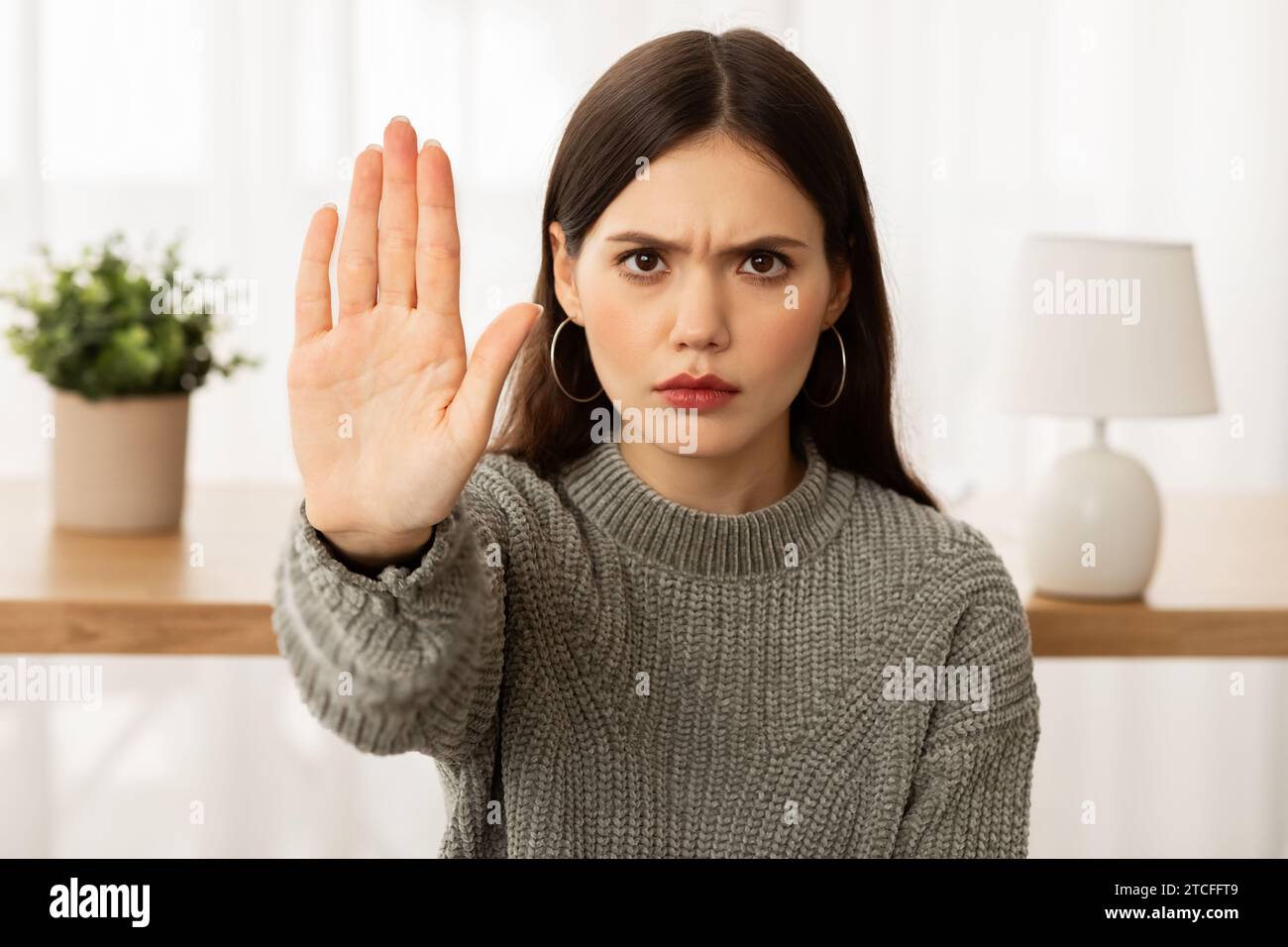 Annoyed woman showing prohibition sign hi-res stock photography and ...