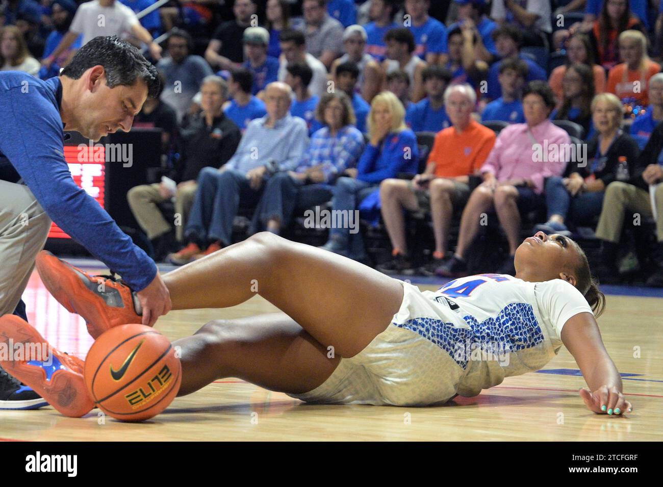 Florida center Ra Shaya Kyle (24) is helped after getting injured ...