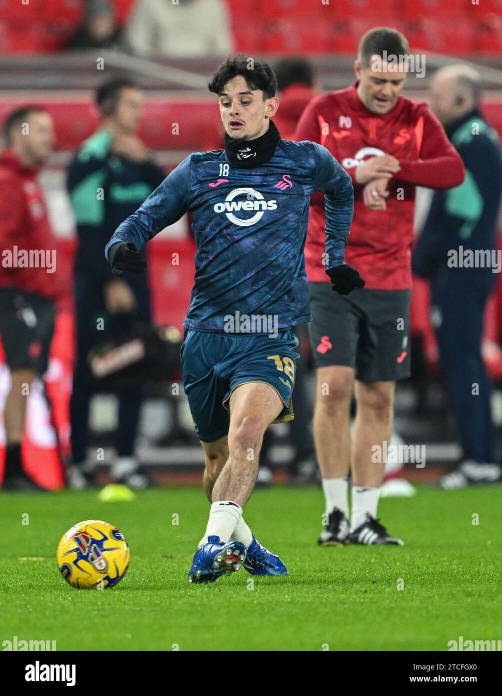 Charlie Patino #18 of Swansea City warms up ahead of the match, during ...