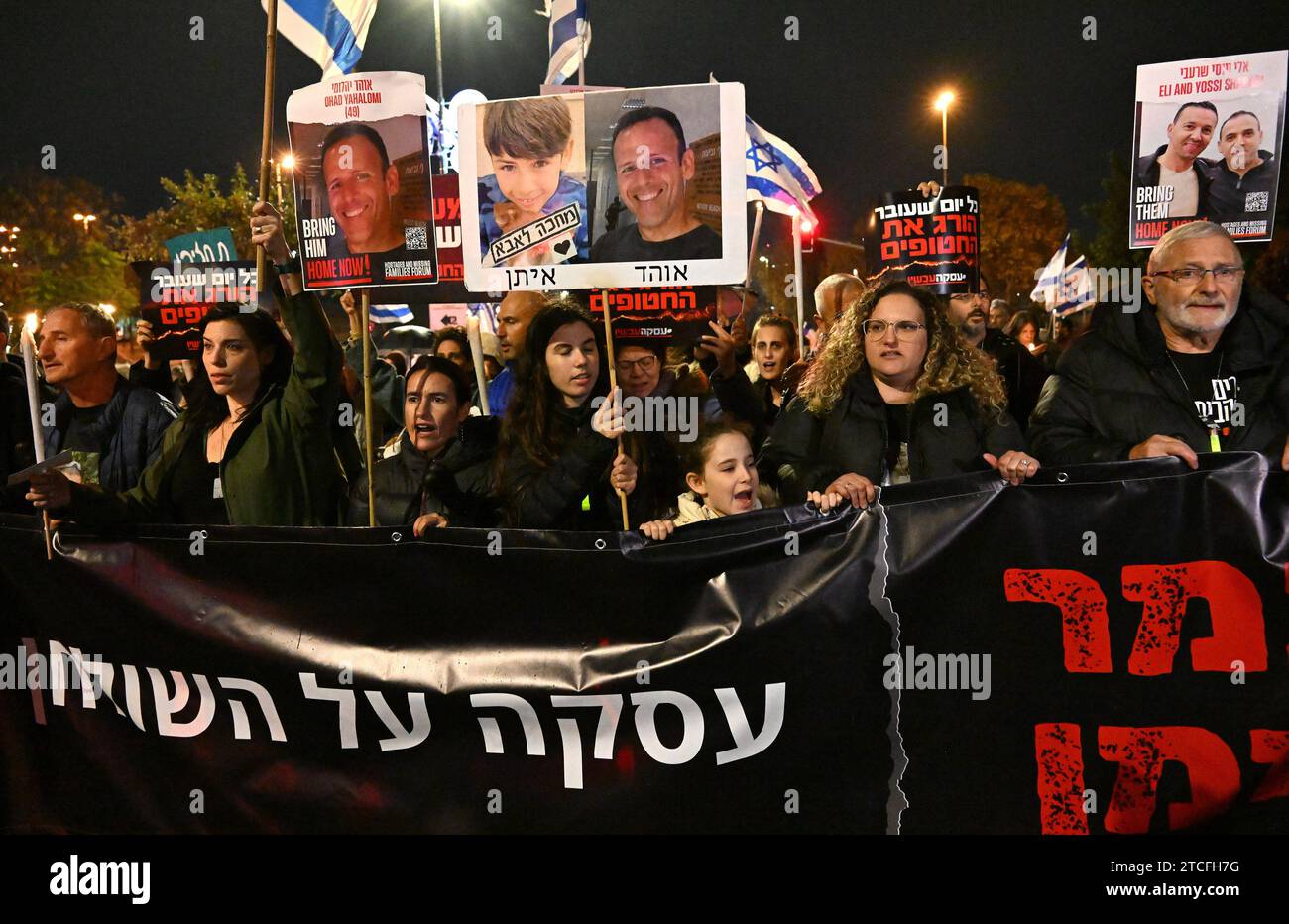 Jerusalem, Israel. 12th Dec, 2023. Families of Israeli hostages carry ...