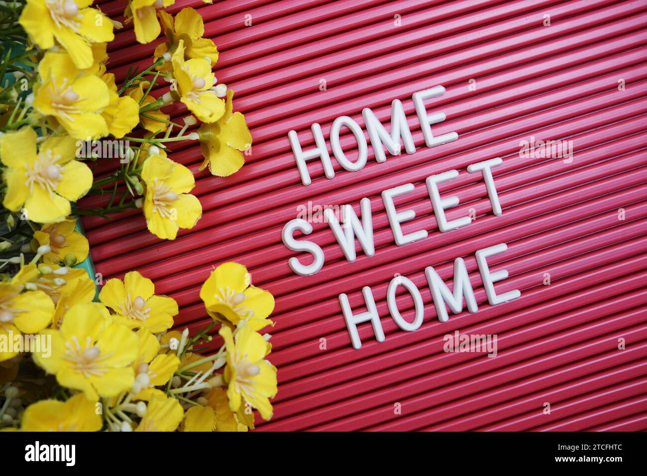 Home Sweet Home text on Letter Board with flower decoration Stock Photo ...