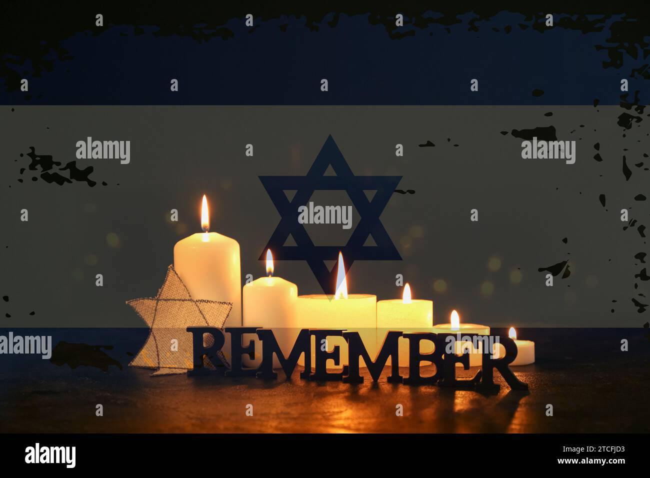 Double exposure of flag of Israel, word REMEMBER and burning candles ...