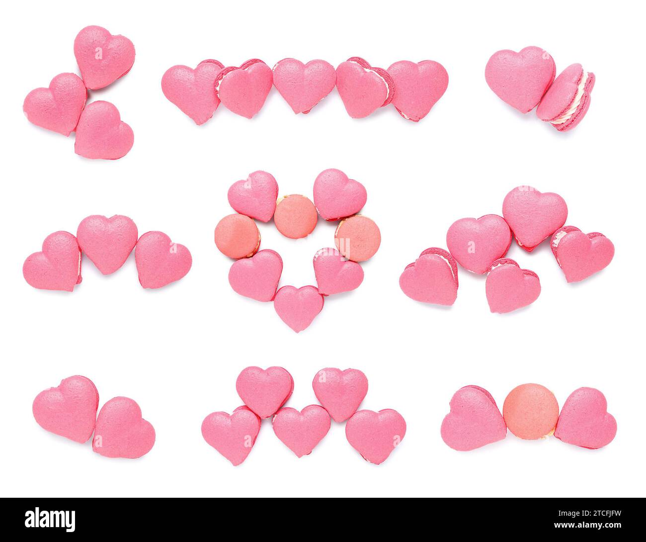 Set of many sweet heart-shaped macarons on white background, top view ...