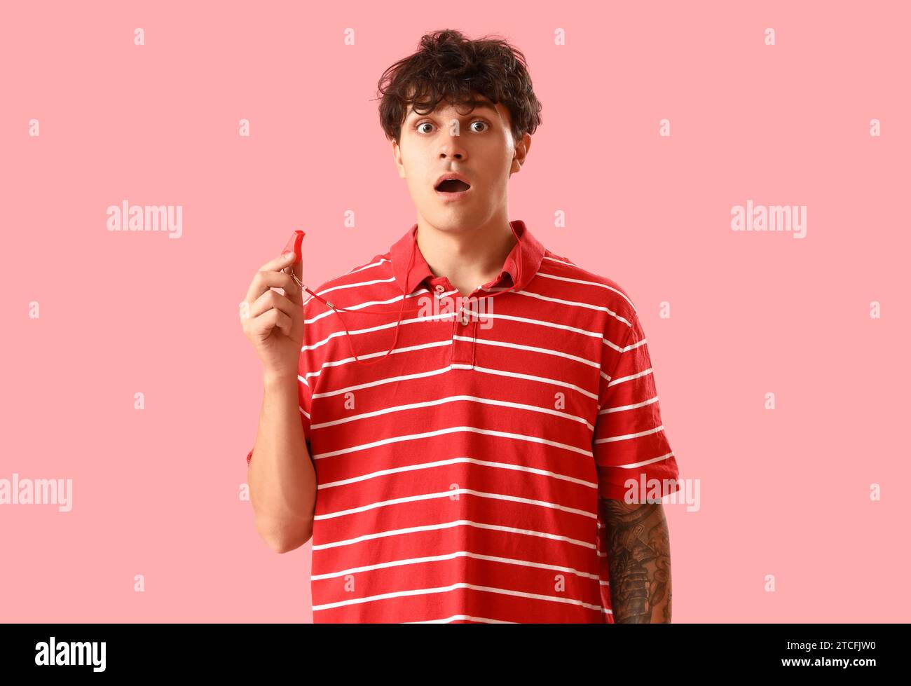 Shocked male lifeguard with whistle on pink background Stock Photo - Alamy