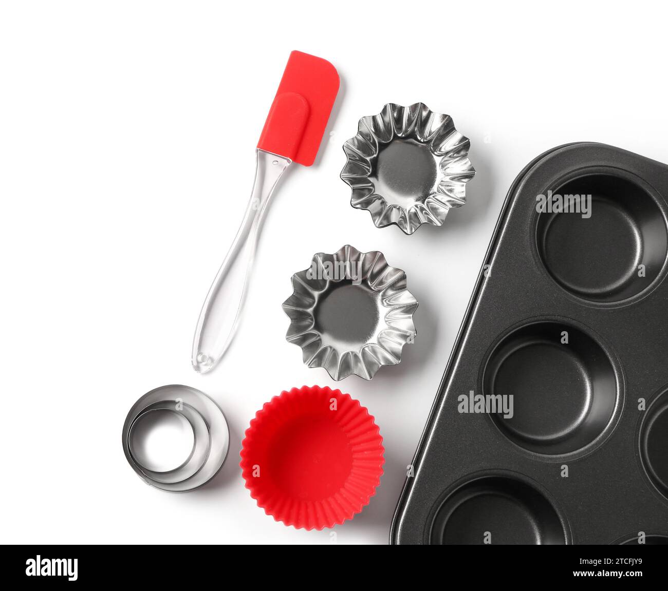Baking forms and spatula isolated on white background Stock Photo - Alamy