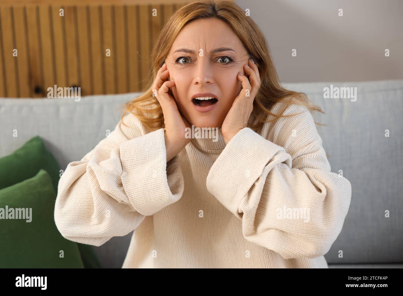 Scared mature woman at home, closeup Stock Photo - Alamy