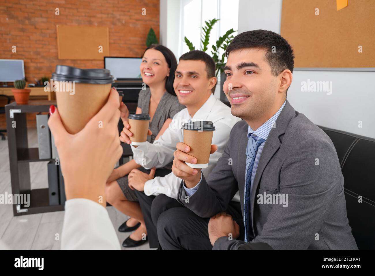 Business colleagues having coffee break in office Stock Photo - Alamy
