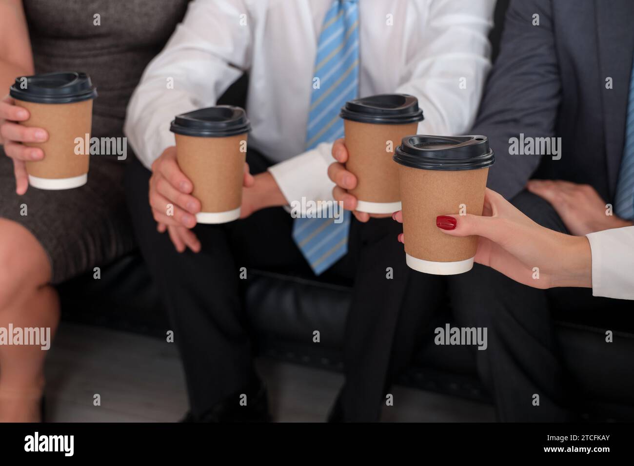 Business colleagues having coffee break in office, closeup Stock Photo ...