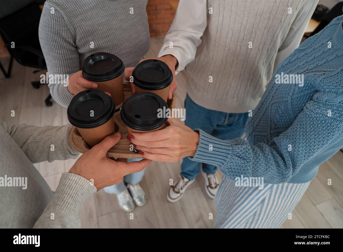Business colleagues having coffee break in office, closeup Stock Photo ...