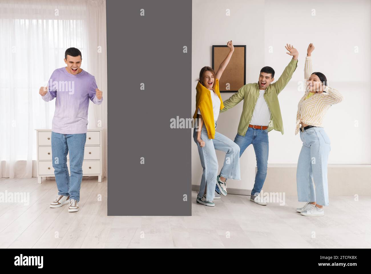 Young man suffering from loud neighbours dancing at home Stock Photo ...