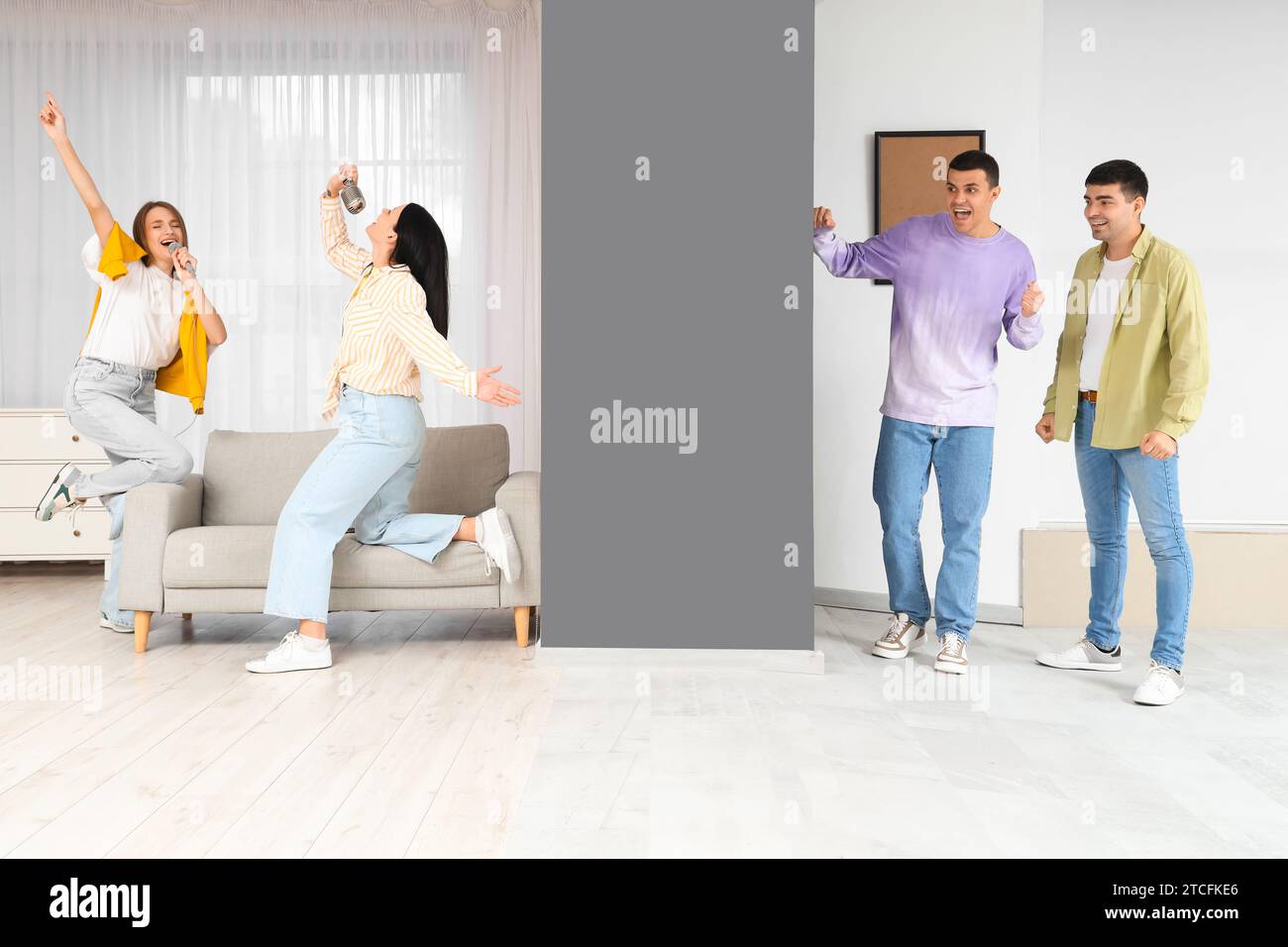 Young men suffering from loud neighbours singing at home Stock Photo ...