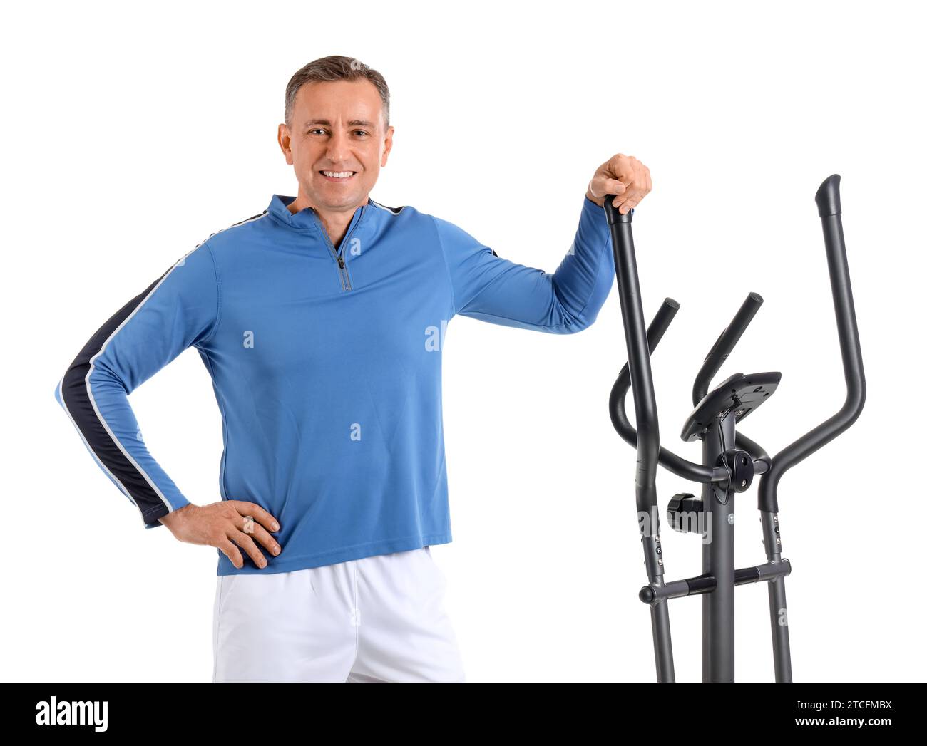 Sporty mature man with exercising bike on white background Stock Photo ...