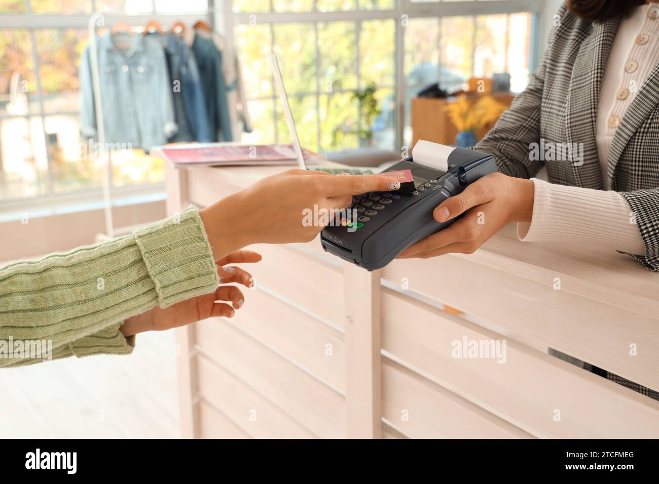 Female shop assistant counter fashion hi-res stock photography and ...