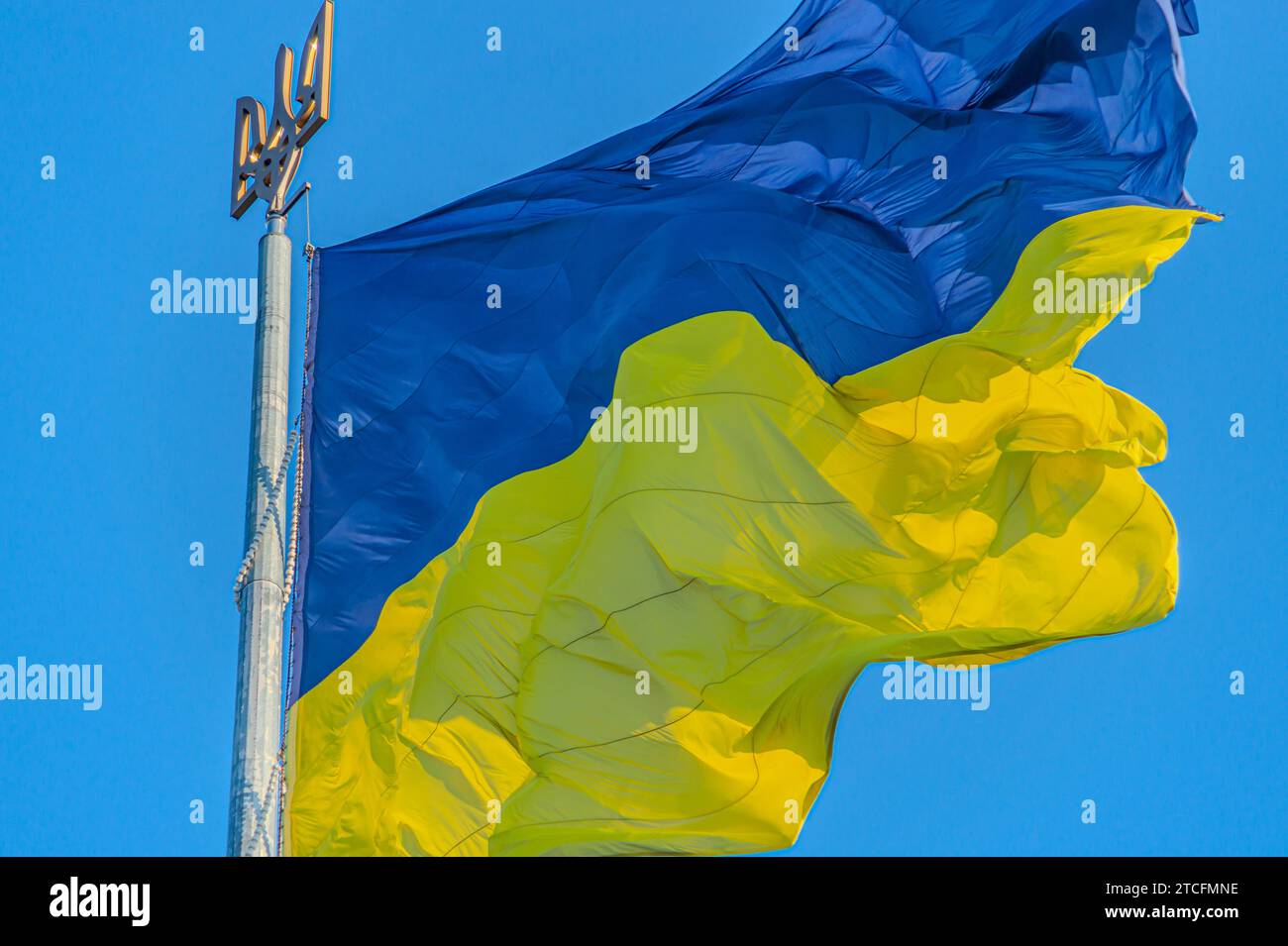 Emblem of Ukraine. Ukraine flag large national symbol fluttering in ...