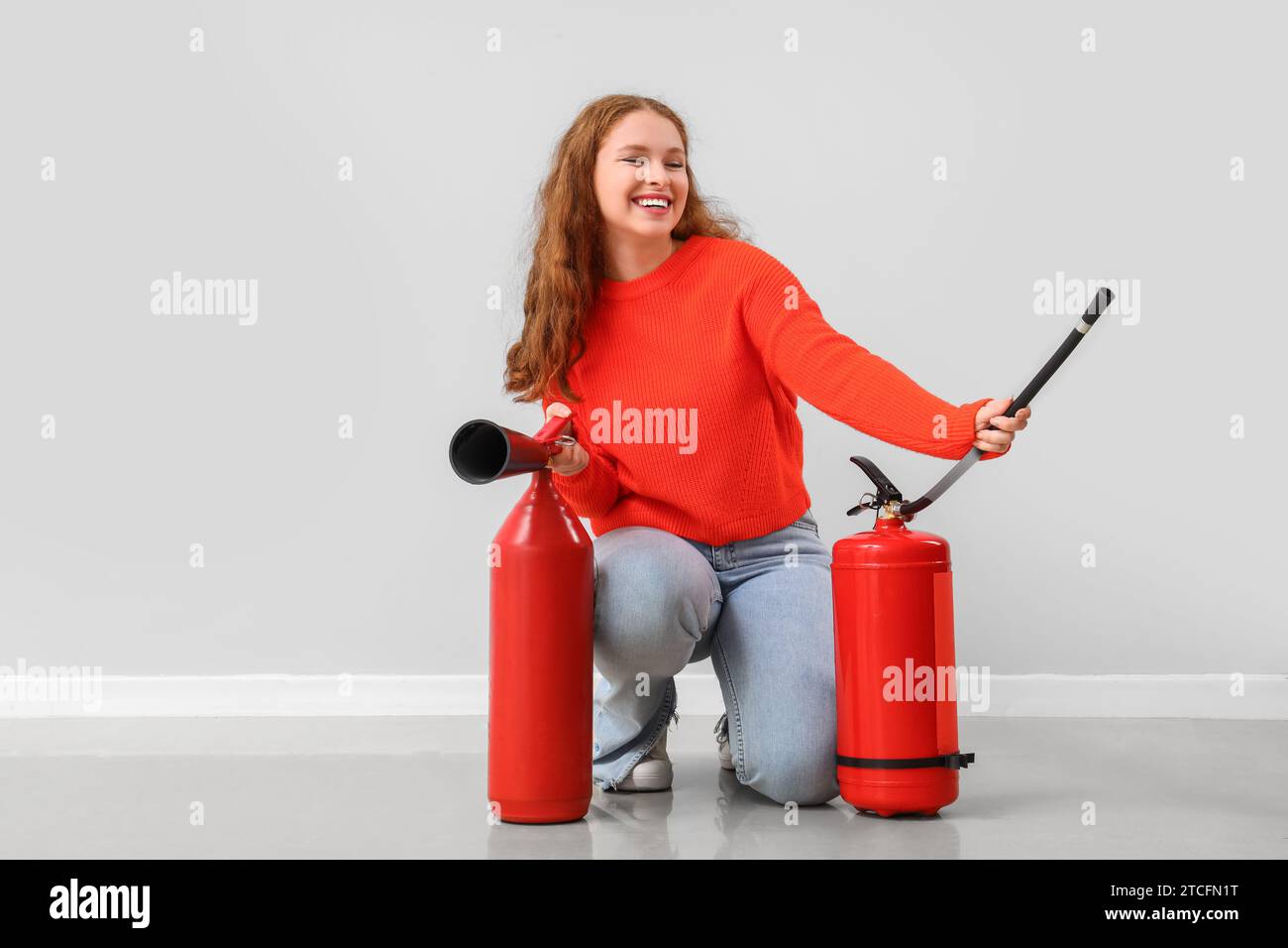 Woman extinguishing fire hi-res stock photography and images - Alamy