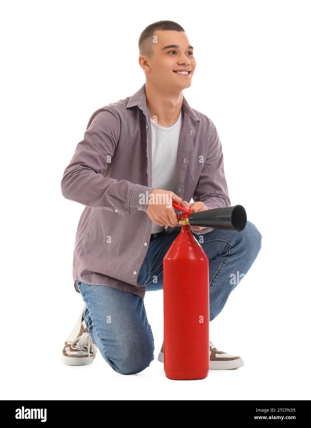 Teenage boy with fire extinguisher on white background Stock Photo - Alamy