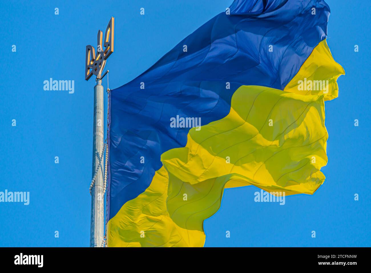 Emblem of Ukraine. Ukraine flag large national symbol fluttering in ...