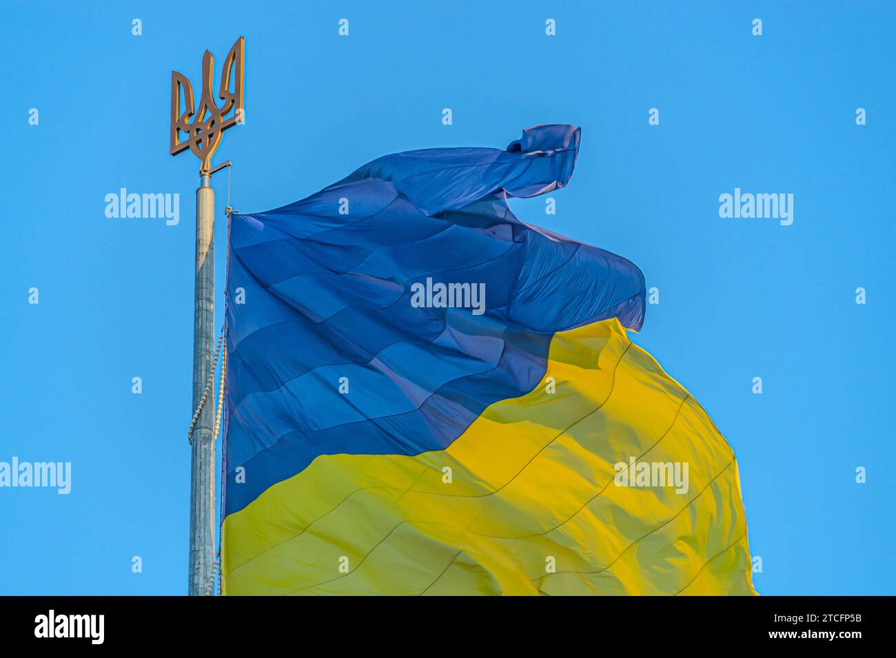 Emblem of Ukraine. Ukraine flag large national symbol fluttering in ...
