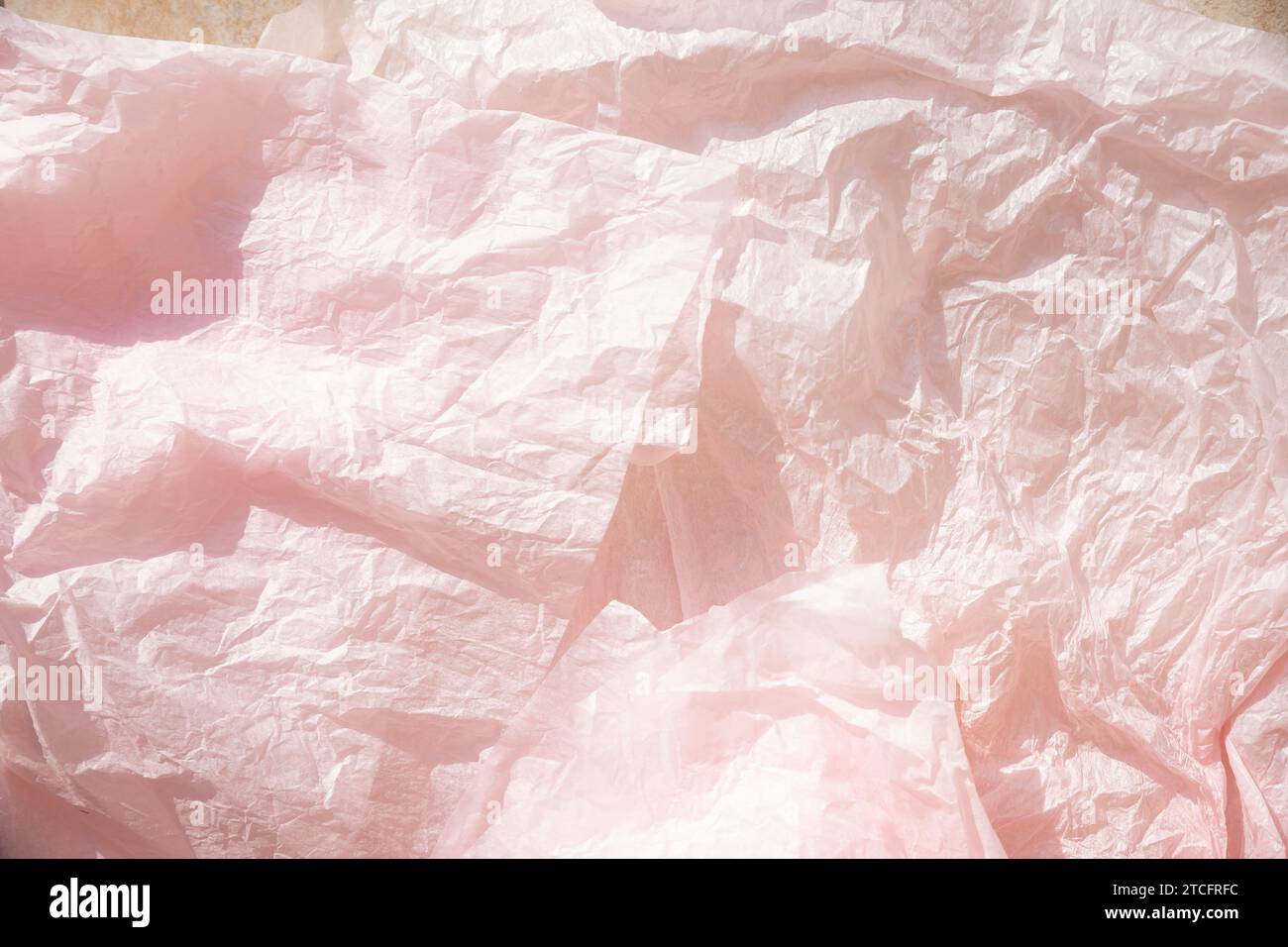 deep rose colored crumpled paper texture background for design ...