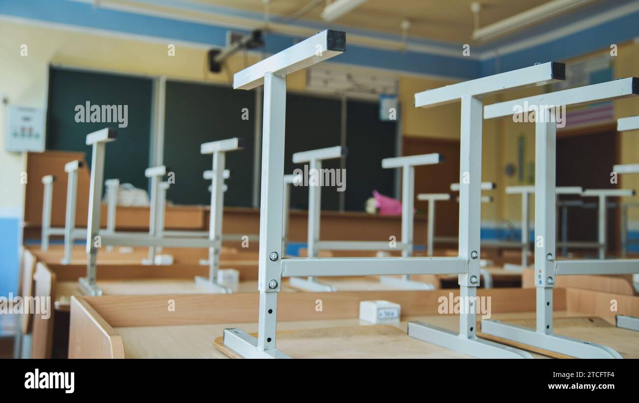 The concept of graduating from high school. Upside-down chairs in an ...