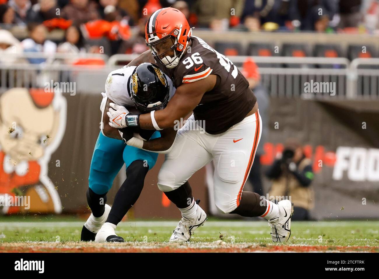 Cleveland Browns defensive tackle Jordan Elliott (96) tackles ...