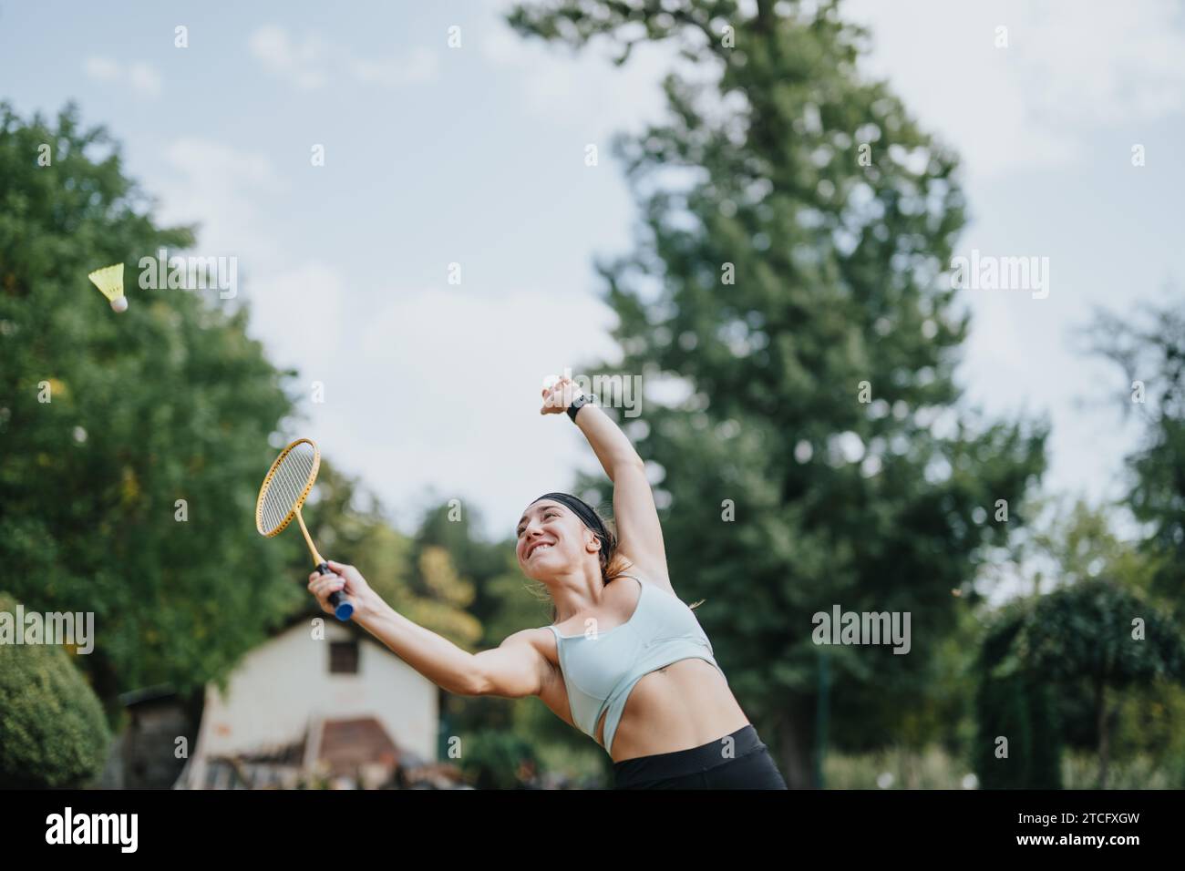 Young Women Playing Badminton With Her Friend in the Park. Woman ...