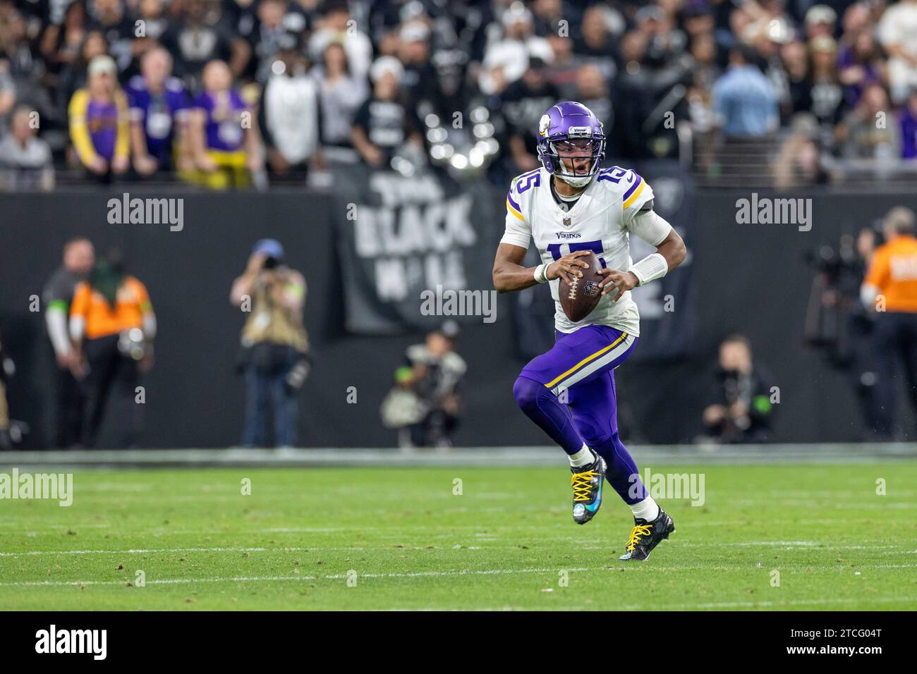 Minnesota Vikings quarterback Joshua Dobbs (15) rolls out against the ...