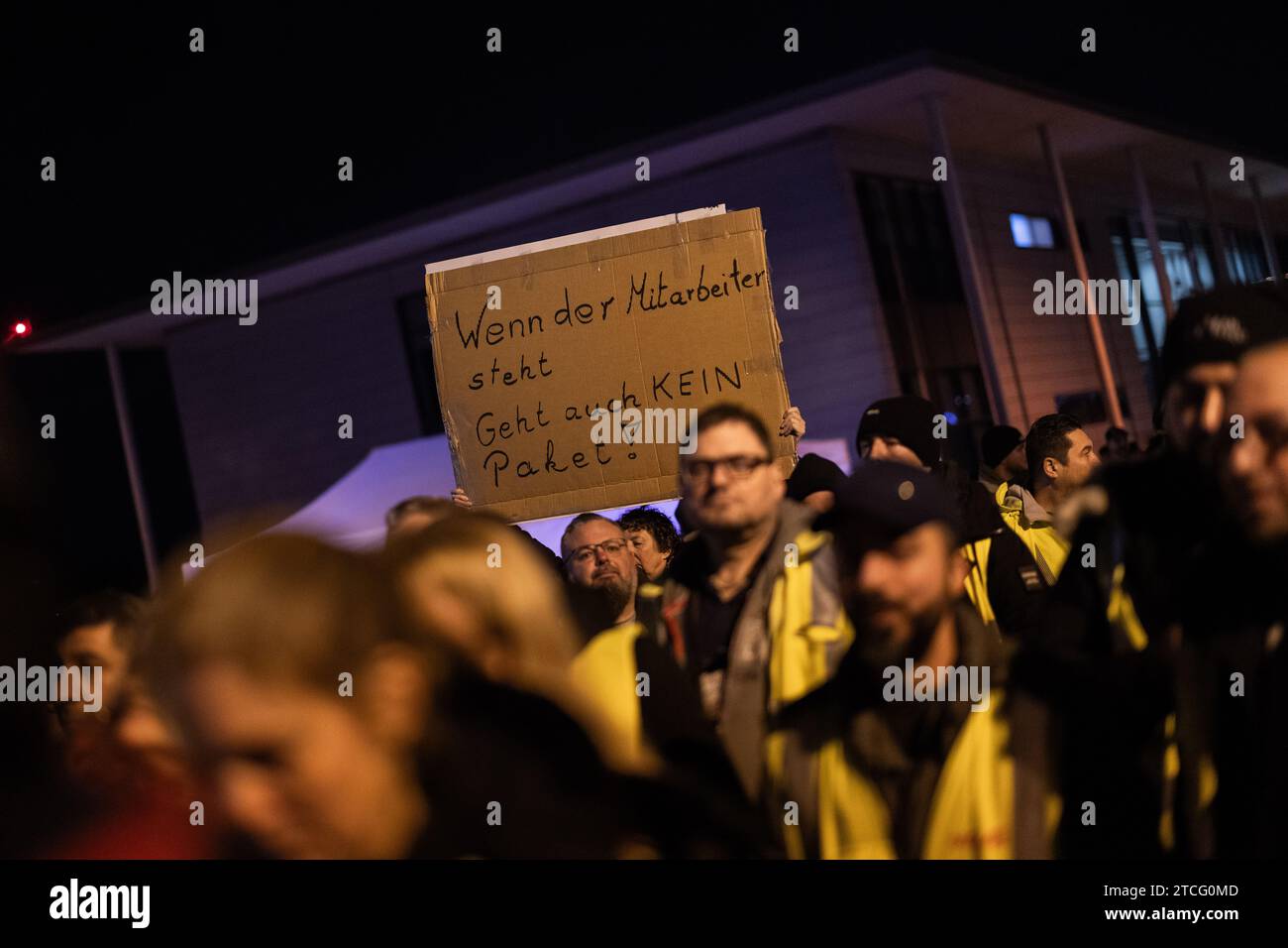 Cologne, Germany. 12th Dec, 2023. Strikers from UPS and Fedex stand in ...