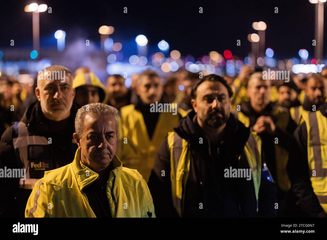 Cologne, Germany. 12th Dec, 2023. Strikers from UPS and Fedex stand in ...