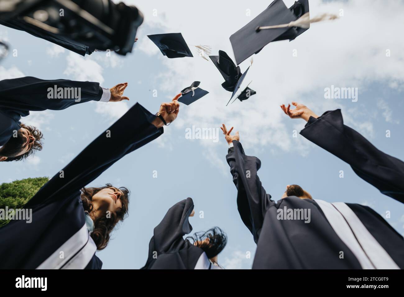 University graduates wear caps and gowns, celebrating achievements ...