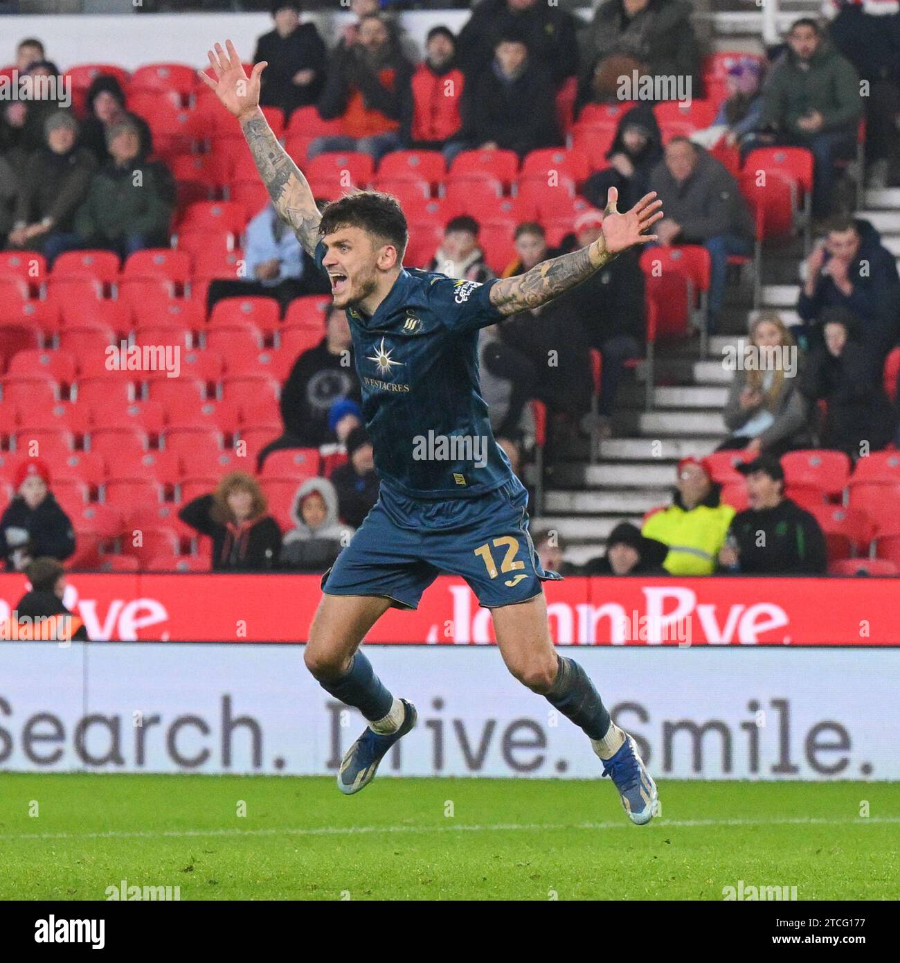 Jamie Paterson #12 of Swansea City reacts after his shot on goal ...