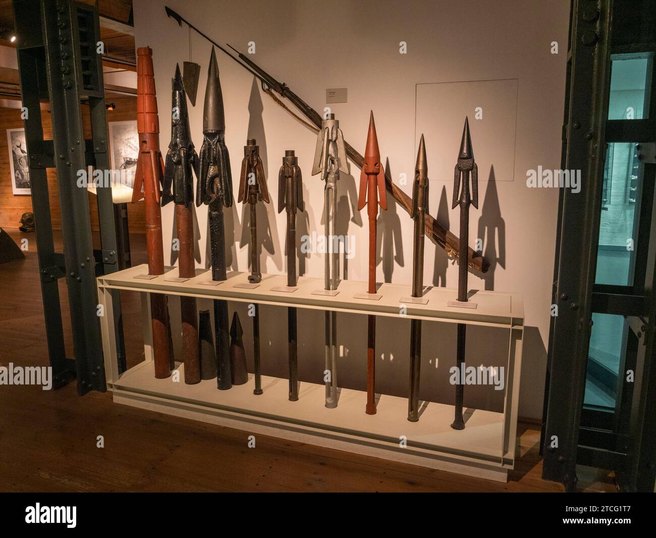 Rack of assorted harpoons through history in the International Maritime ...